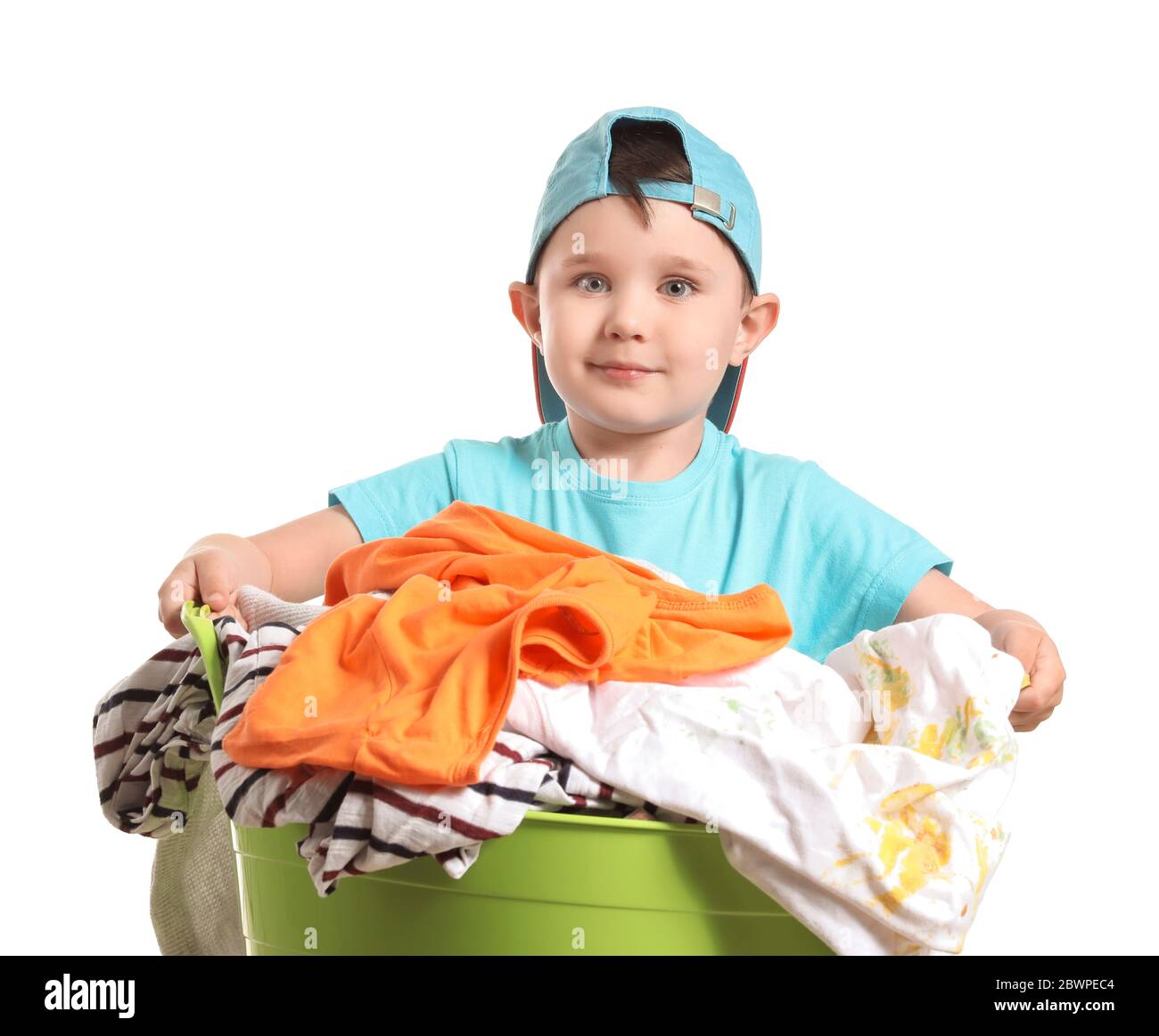Little boy with laundry on white background Stock Photo - Alamy