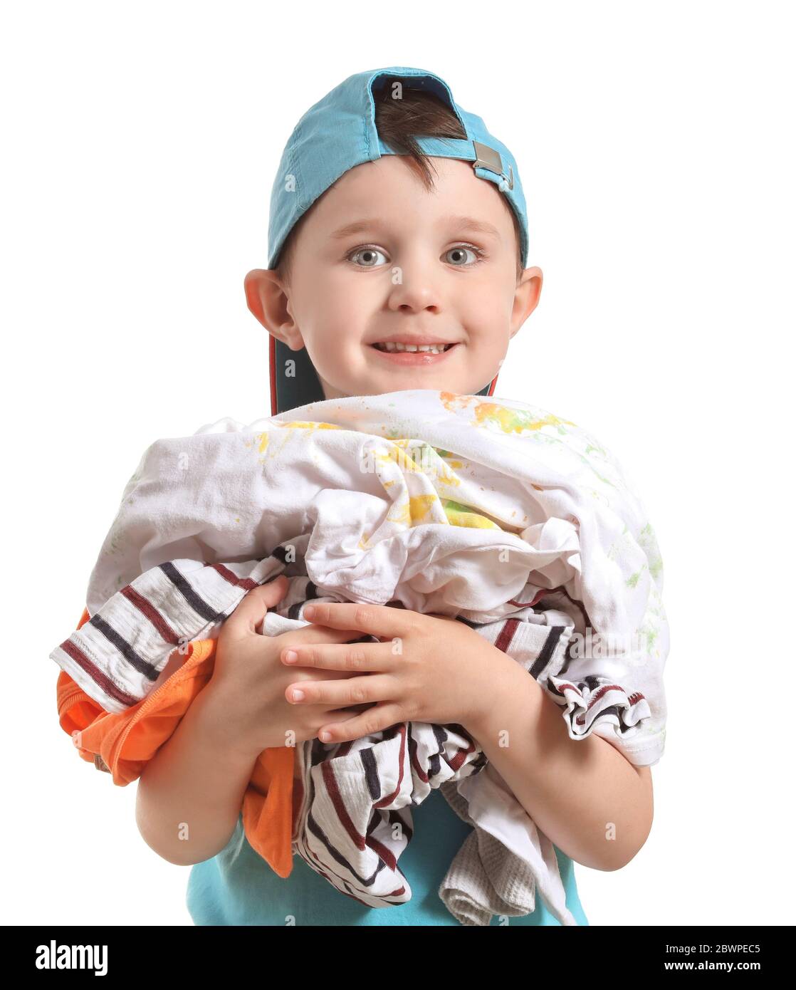 Little boy with laundry on white background Stock Photo - Alamy