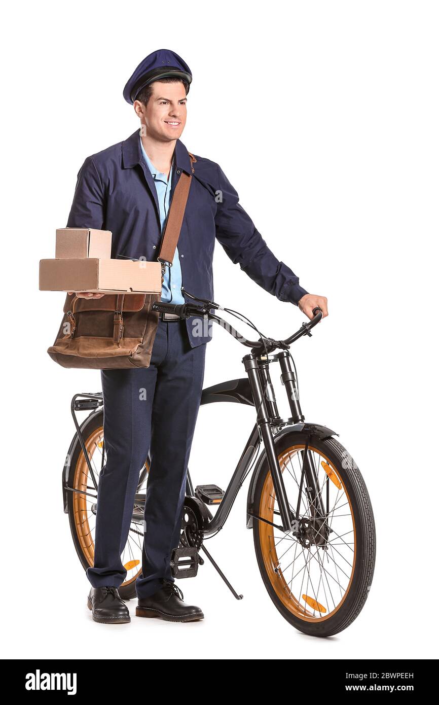 Handsome young postman with bicycle on white background Stock Photo - Alamy