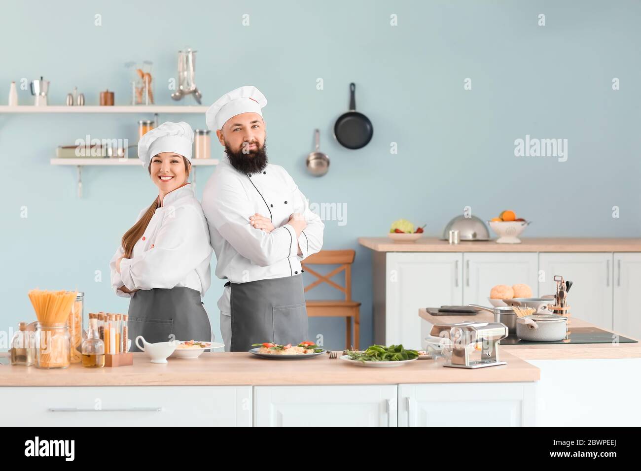 Portrait of chefs in kitchen Stock Photo - Alamy