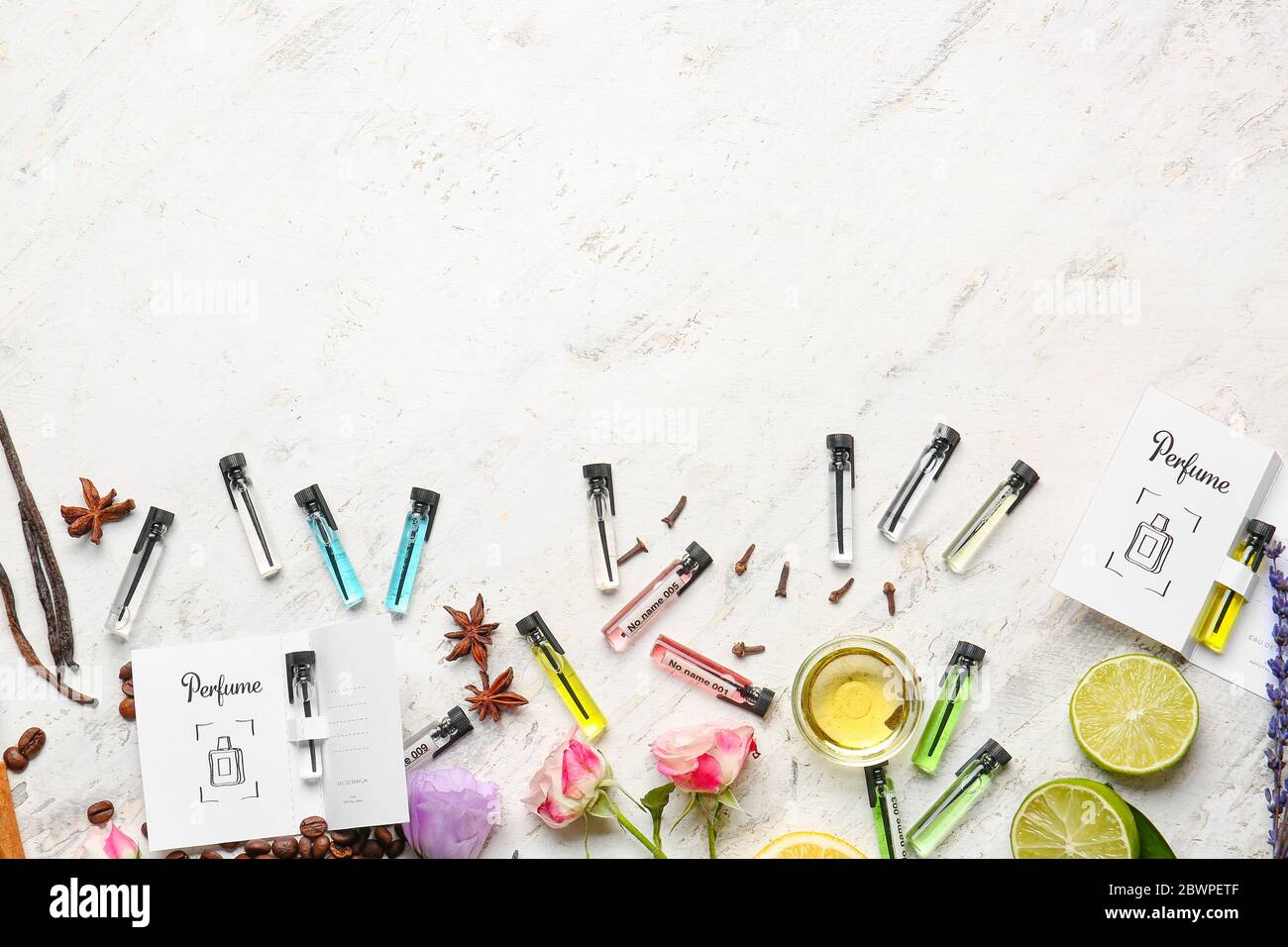 Perfume samples on light background Stock Photo - Alamy