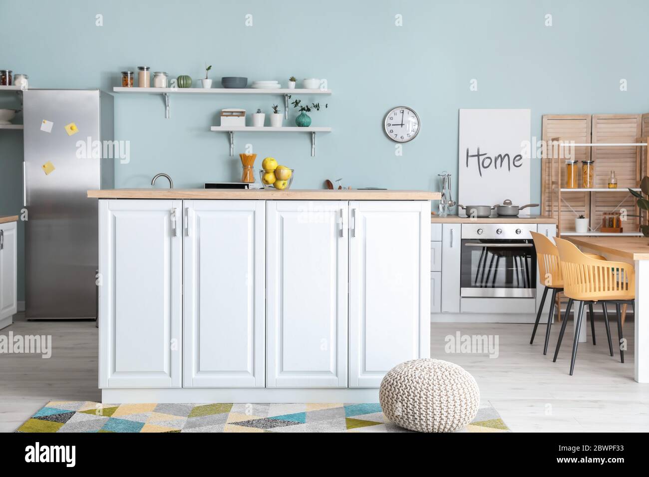 Interior of modern kitchen with stylish table Stock Photo - Alamy