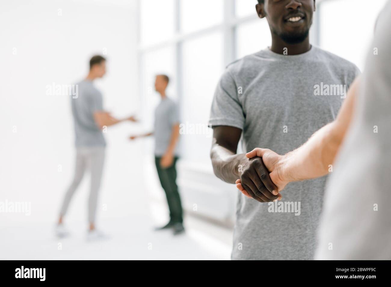 close up. friendly handshake of young people Stock Photo - Alamy