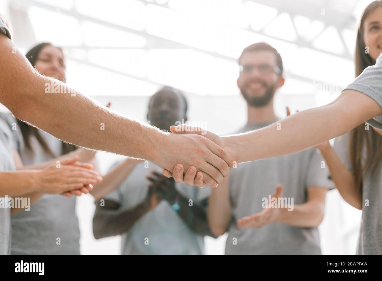 Two students shaking hands on hi-res stock photography and images - Alamy