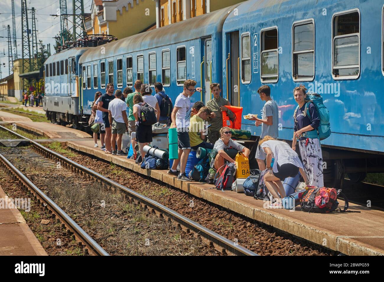 Group of students boarding a train Stock Photo - Alamy
