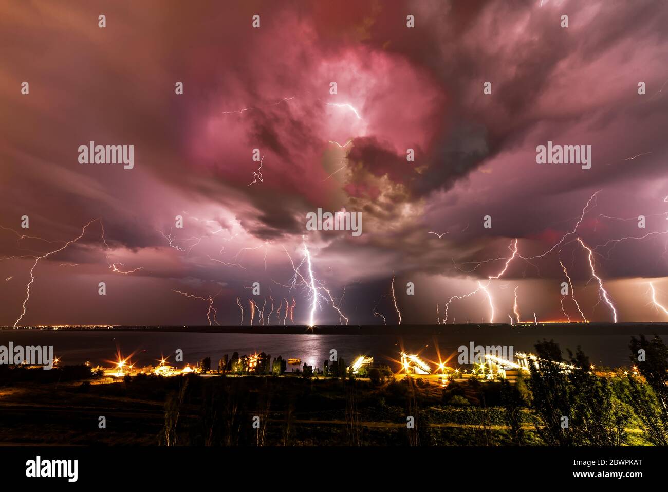 A huge number of bright and terrible lightning over the river Stock ...