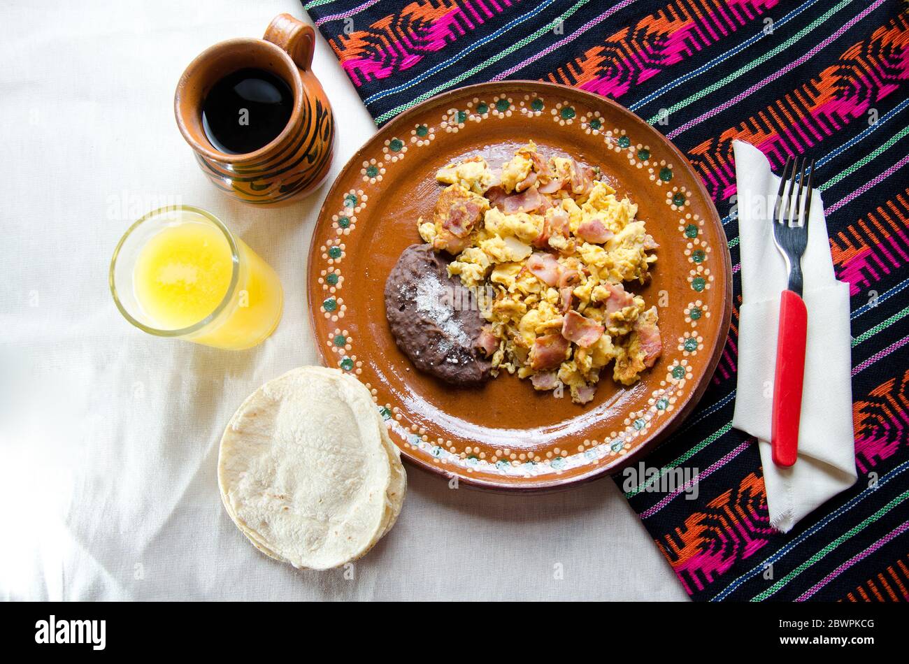 Mexican breakfast: Scrambled eggs with ham and coffee Stock Photo - Alamy