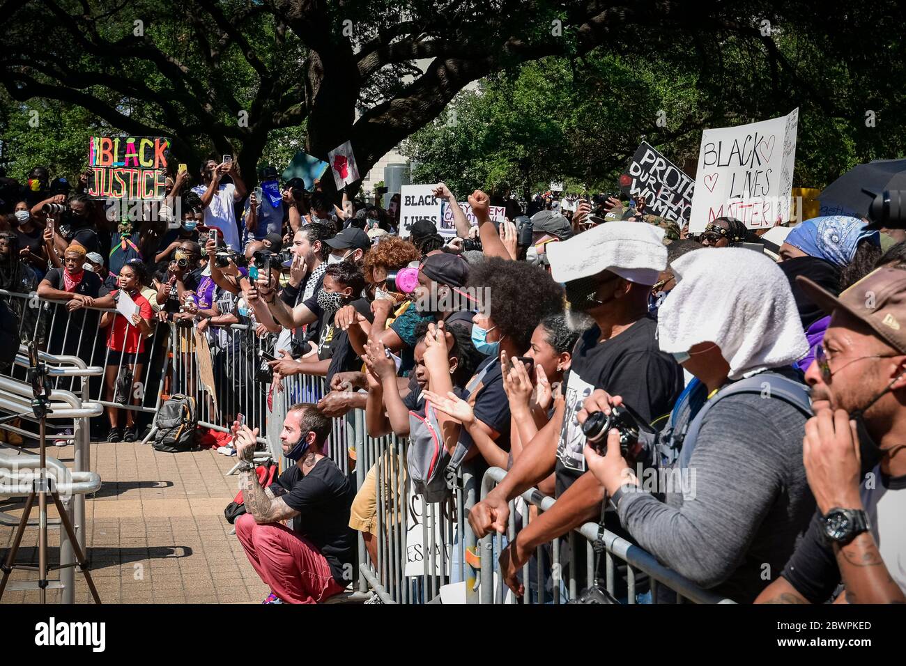 Houston, Texas, USA. 2nd June, 2020. Protesters stand on the lawn at ...