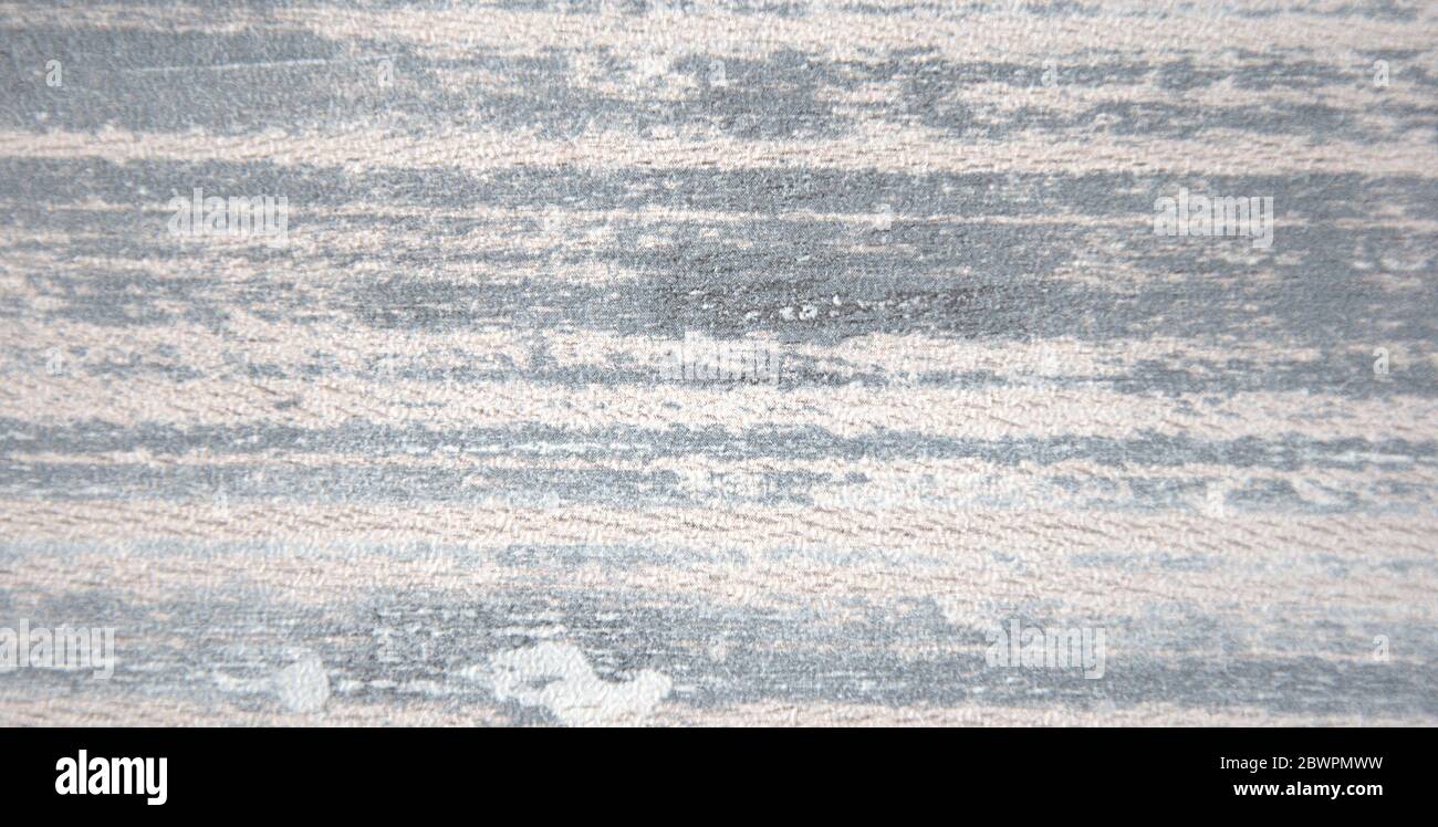 Roughly processed surface of natural stone of gray color with white ...