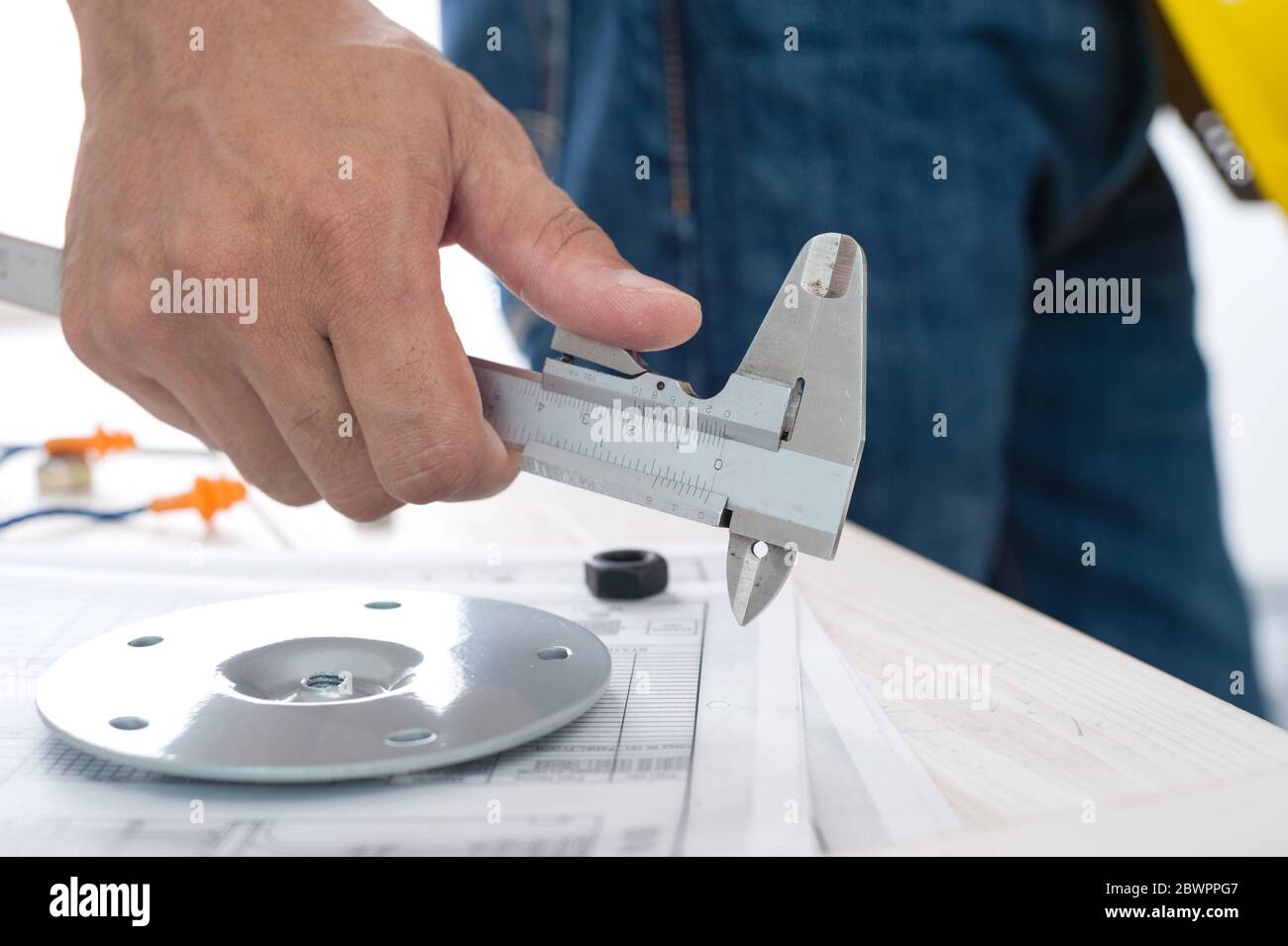 metal vernier caliper in engineer's hand, vernier caliper is a ...