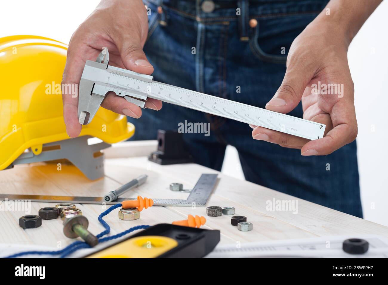 metal vernier caliper in engineer's hand, vernier caliper is a ...