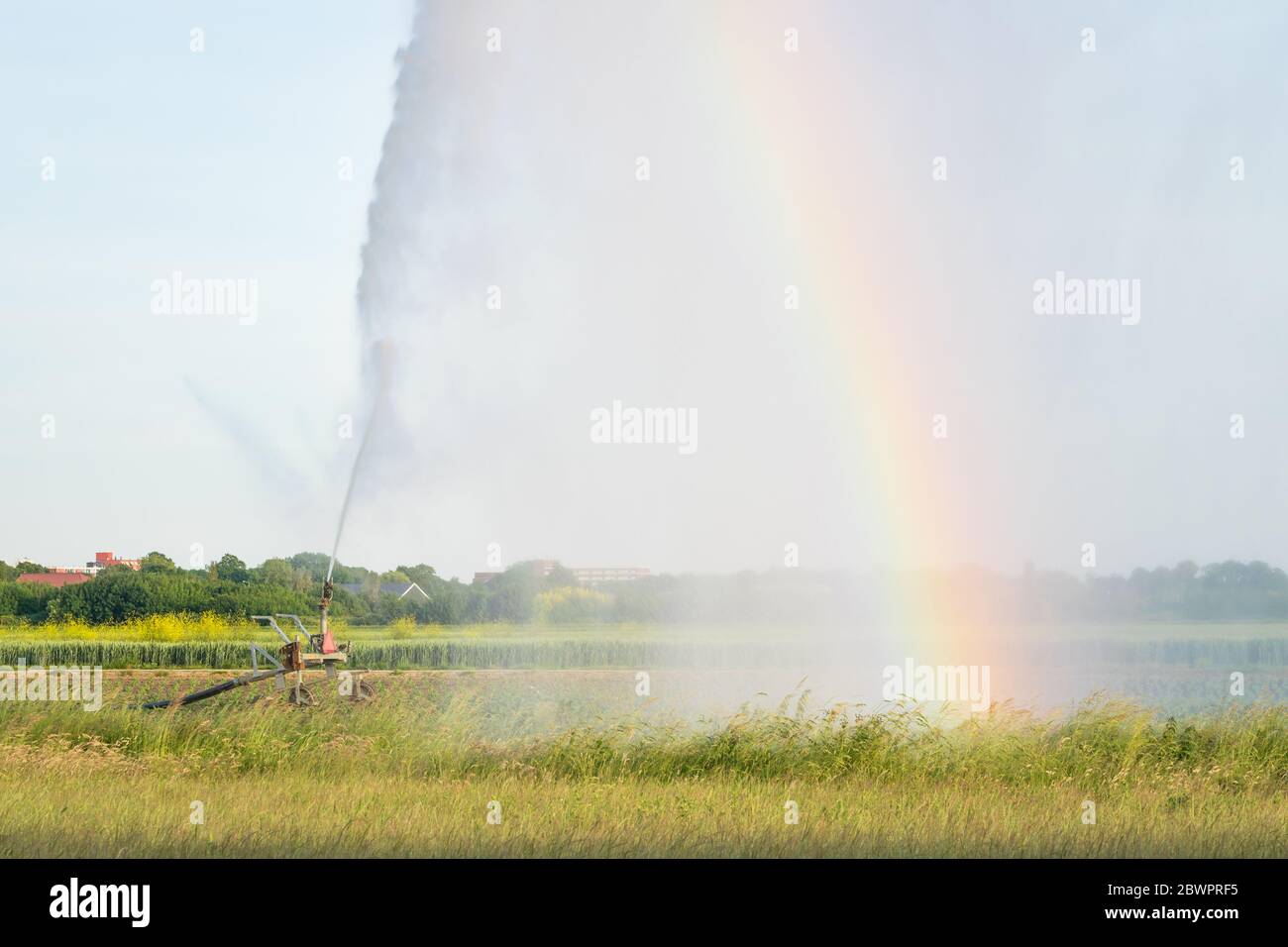 Rainbow caused by the refraction of sunlight in water droplets from an ...