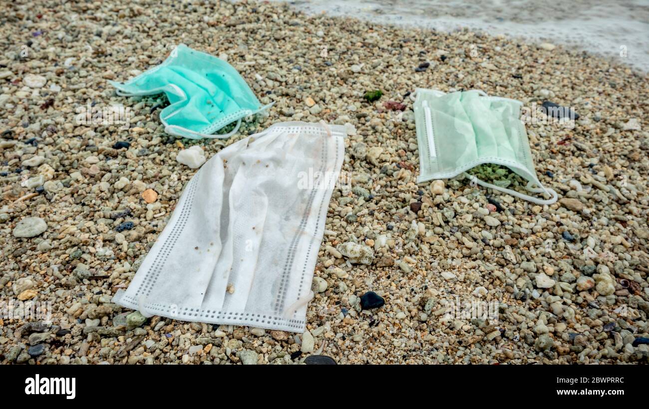 Coronavirus plastic waste polluting the environment. Disposable masks ...