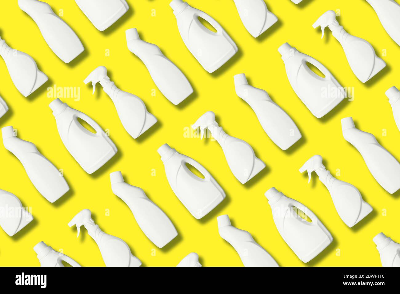 Plastic bottles pattern of cleaning products on yellow background ...