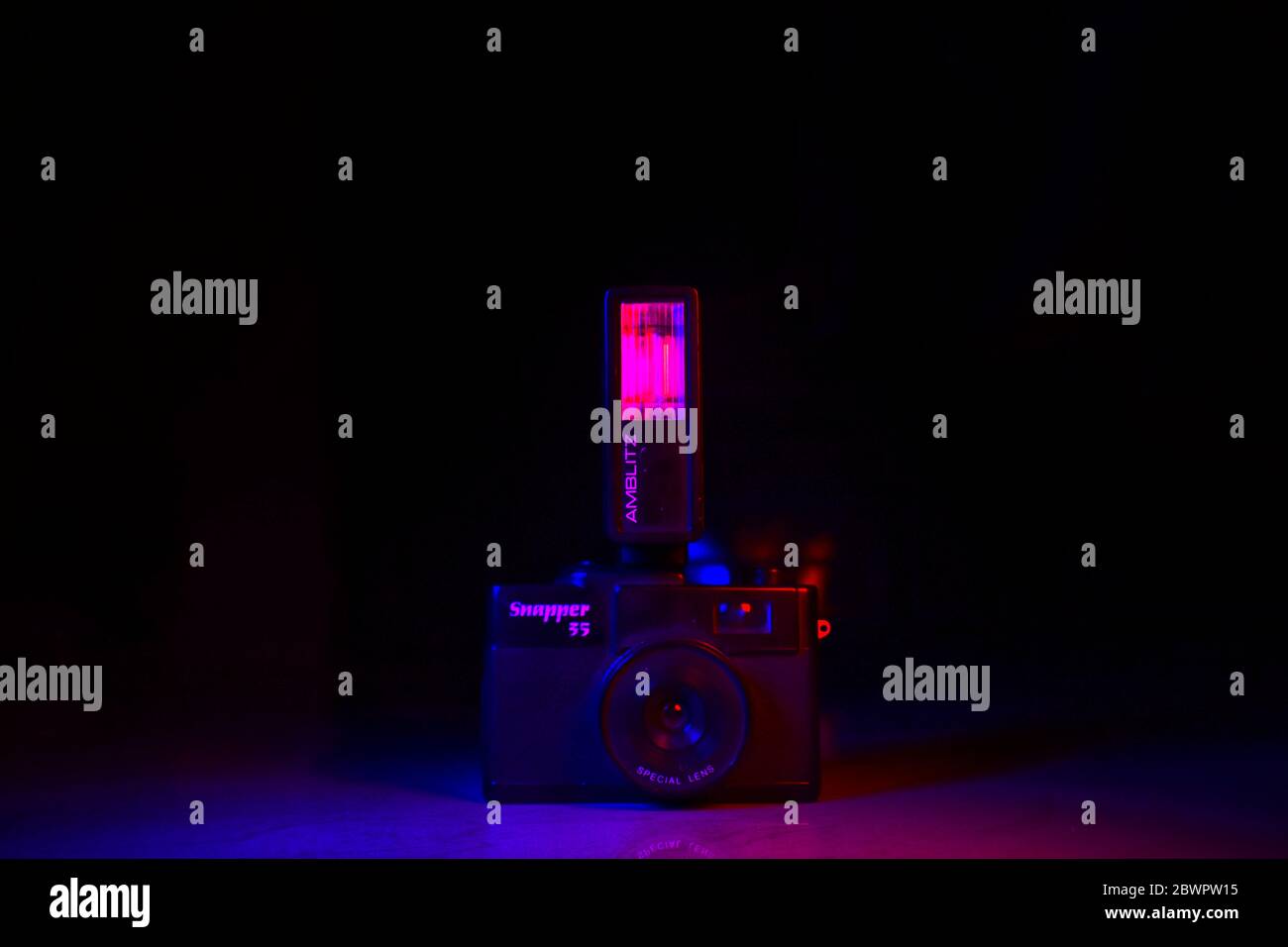 An antique camera . snapper 35 black and white camera . red and blue ...