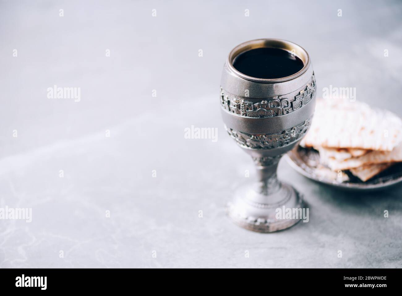 Jewish kiddush wine cup for passover with matzot, matzo bread. Pesah ...