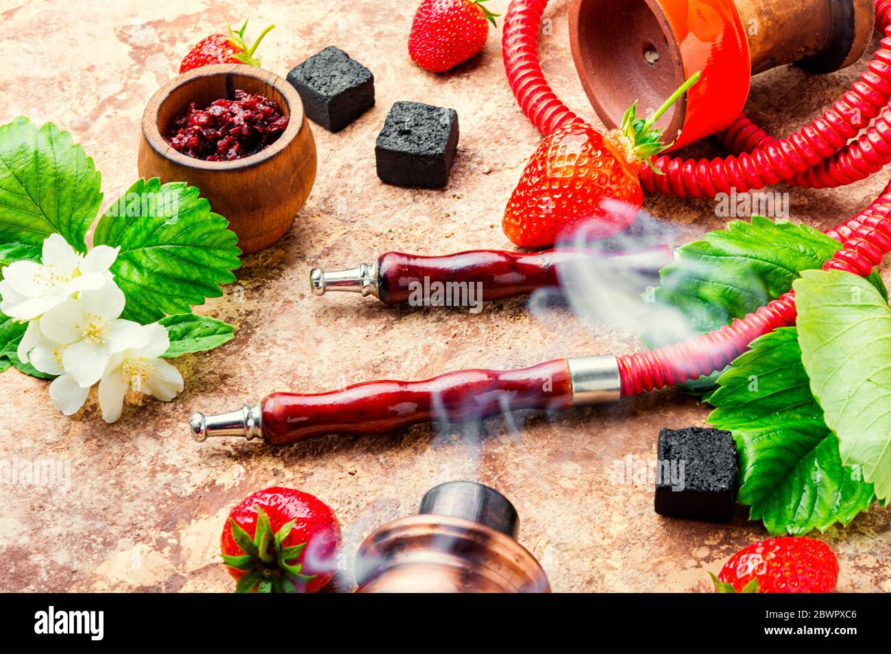 Oriental smoking shisha with strawberry tobacco. Berry hookah tobacco ...