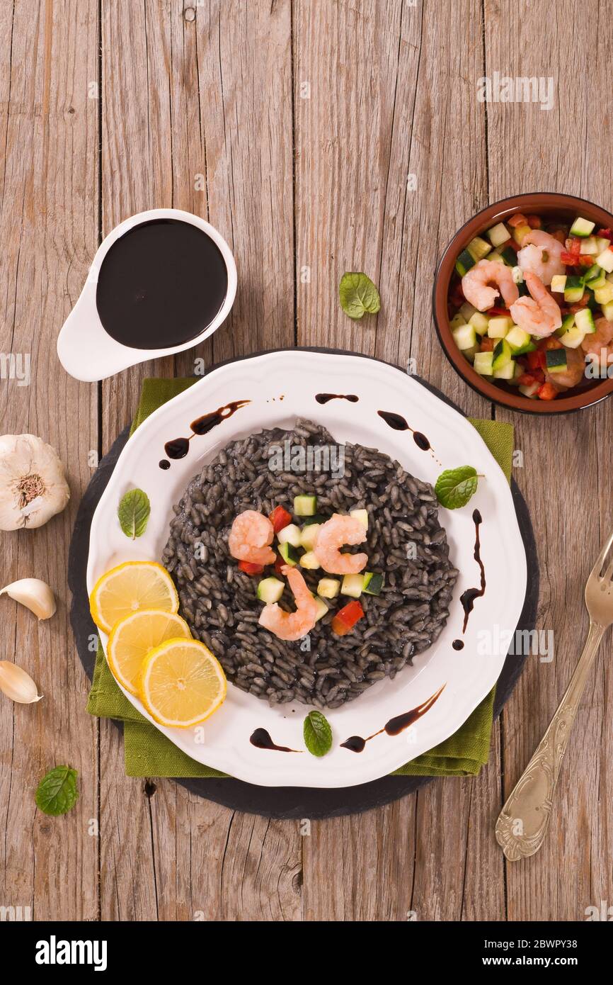 Squid ink risotto Stock Photo - Alamy