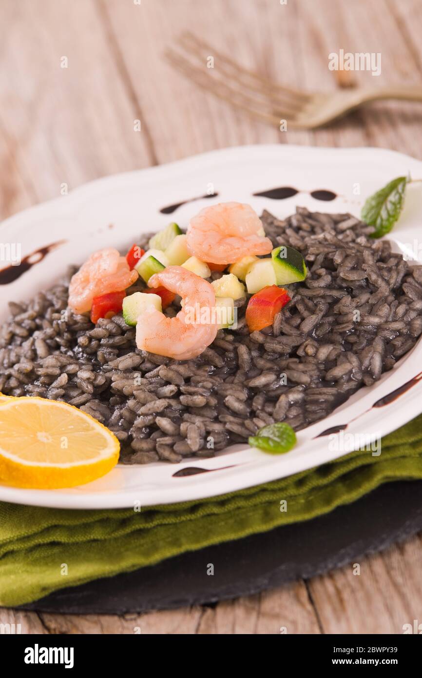 Squid ink risotto Stock Photo - Alamy