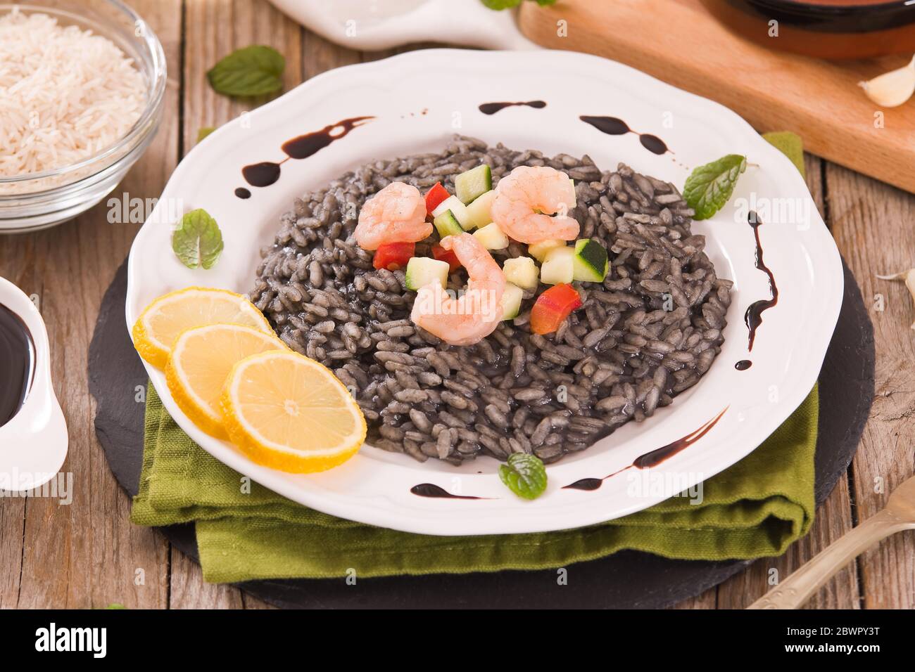 Squid ink risotto Stock Photo - Alamy