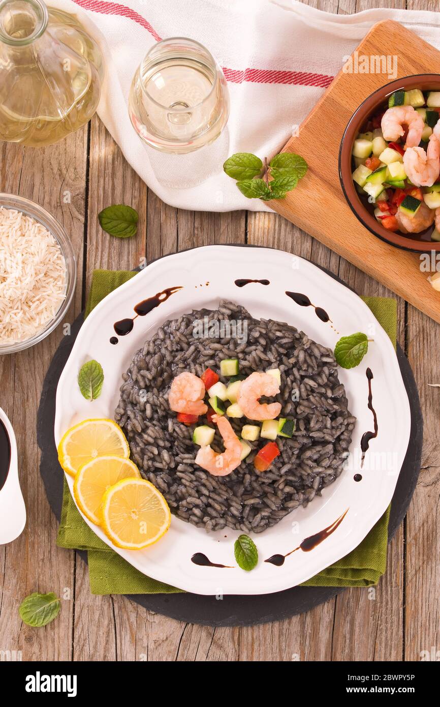 Squid ink risotto Stock Photo - Alamy