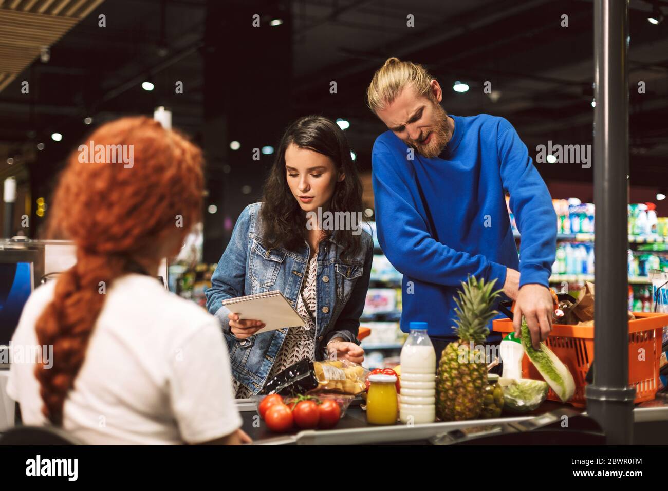 Family shopping at supermarket cashier hi-res stock photography and ...