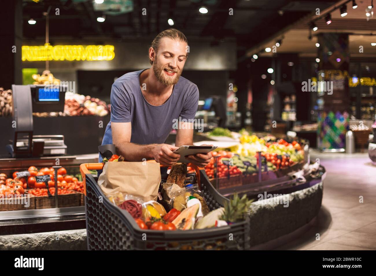 Leaning on trolley hi-res stock photography and images - Alamy