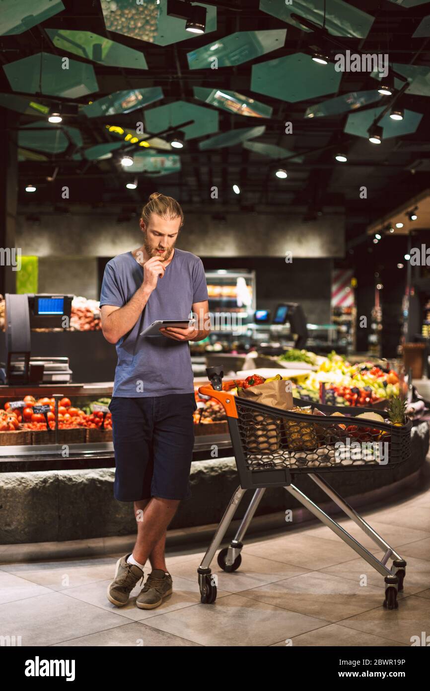 Variety reading grocery list reading shopping list hi-res stock ...