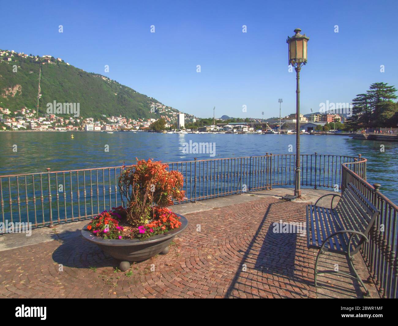 Como - Italy. panoramic view of Como Lake from a terrace with bench and ...