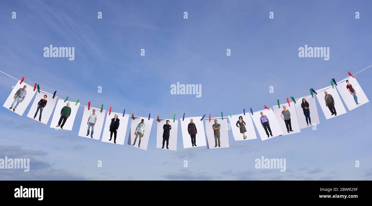 portraits of person hanging from a clothesline in a field Stock Photo ...