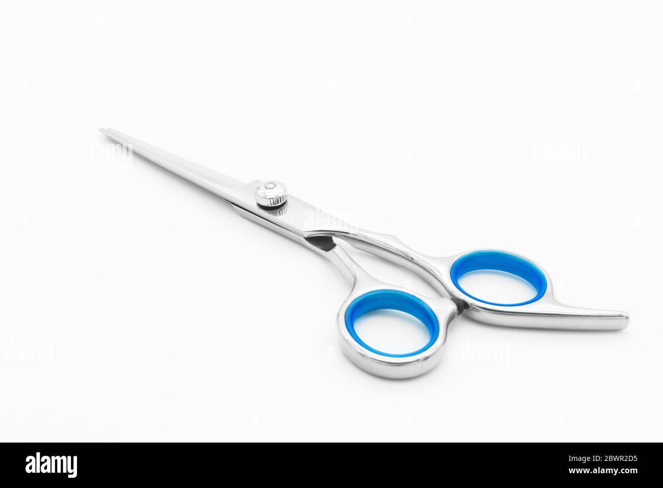 Close-up view of the flat cutting scissor isolated on white background ...