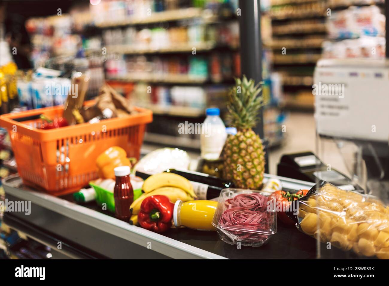 Female cashier in supermarket hi-res stock photography and images - Alamy