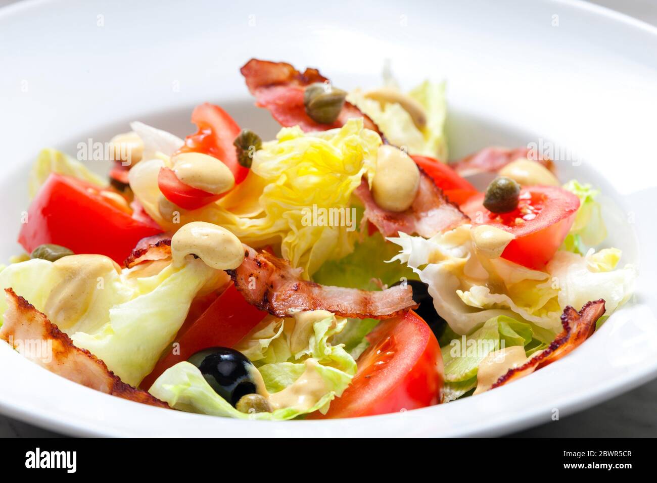 vegetable salad with bacon and capers Stock Photo - Alamy