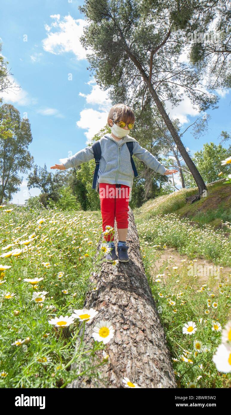 Boy walking on log hi-res stock photography and images - Alamy