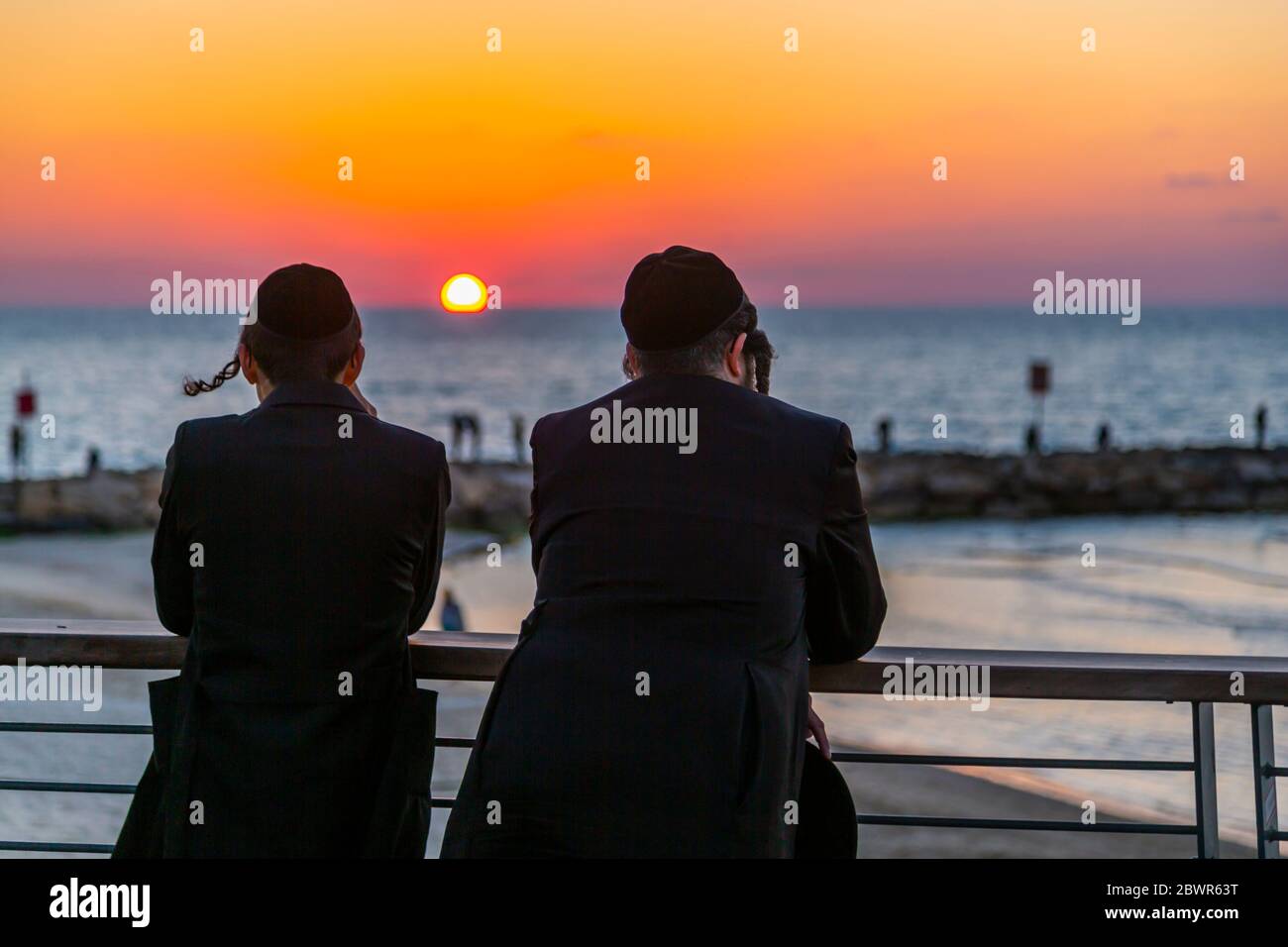 View of two Jewish men on promenade at sunset, Hayarkon Street, Tel ...