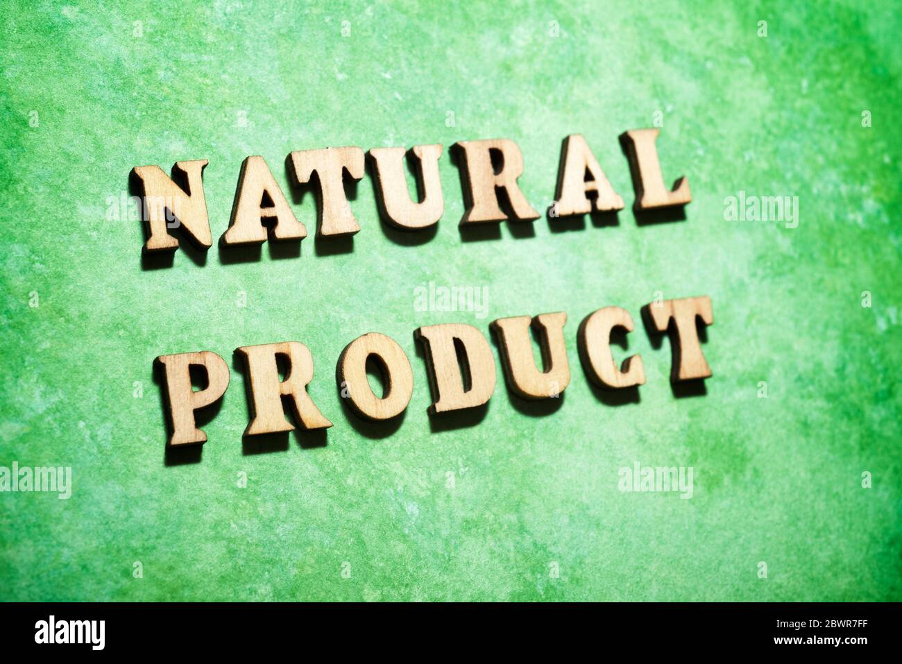 Natural product text on a green paper Stock Photo - Alamy
