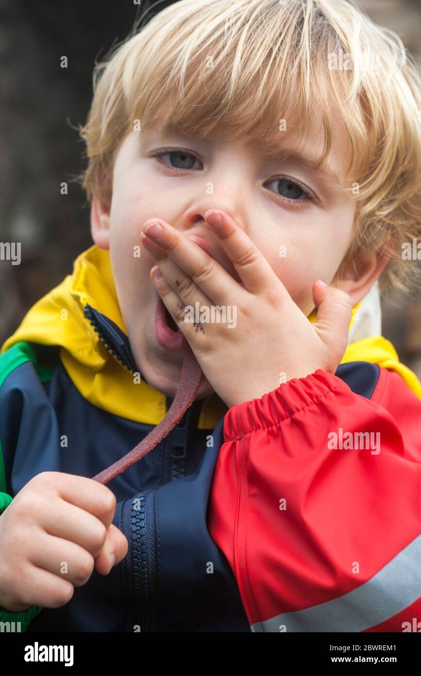 Infant eating vertical hi-res stock photography and images - Alamy