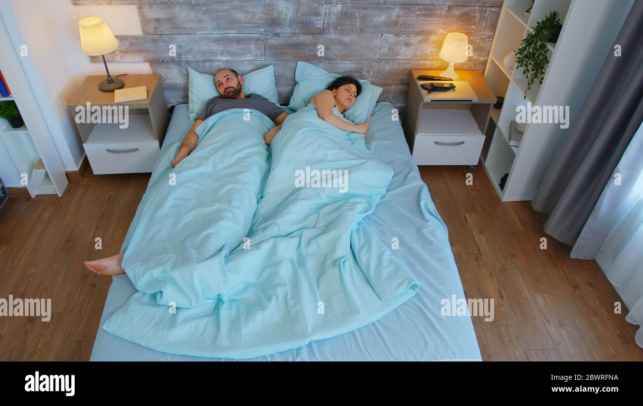 Couple sleeping in bed top view hi-res stock photography and images - Alamy