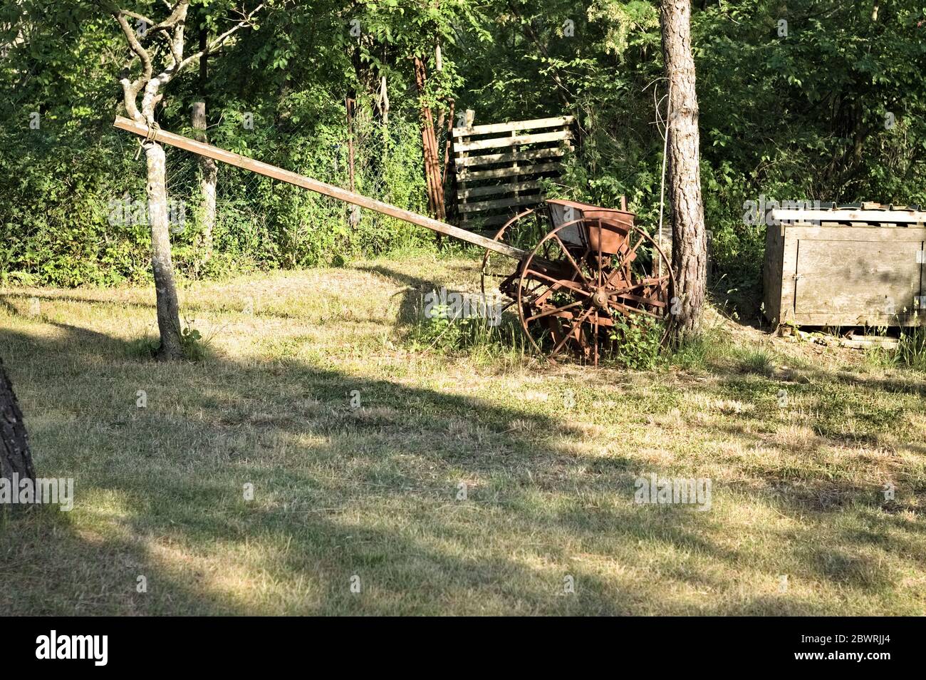 A rusty plow in the countryside fields near a farm (Pesaro, Italy ...