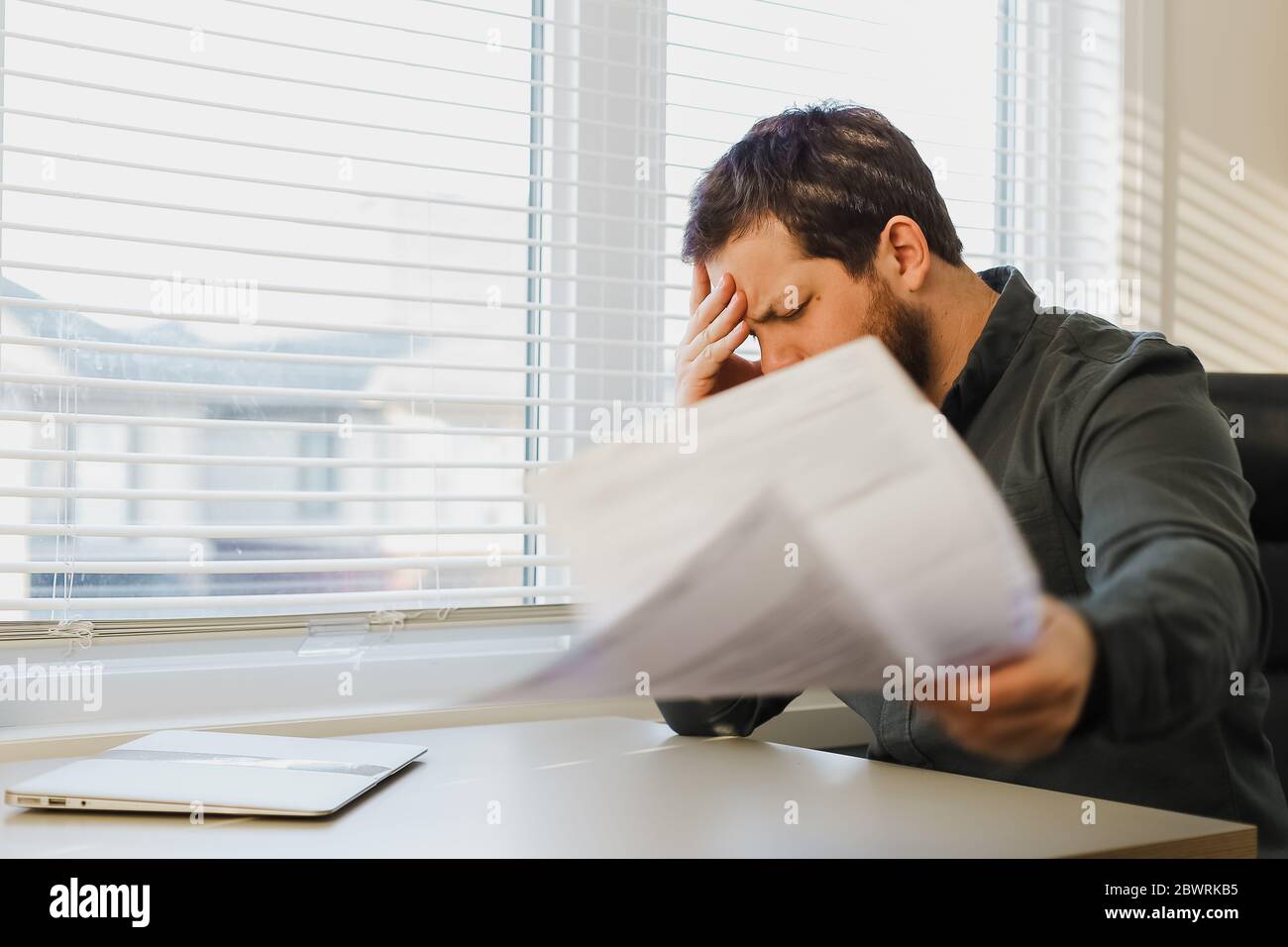 Thinking business director giving documents at office Stock Photo - Alamy