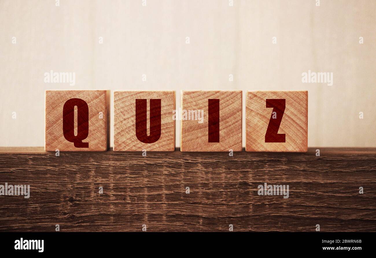 QUIZ word made with building blocks on wooden table Stock Photo - Alamy