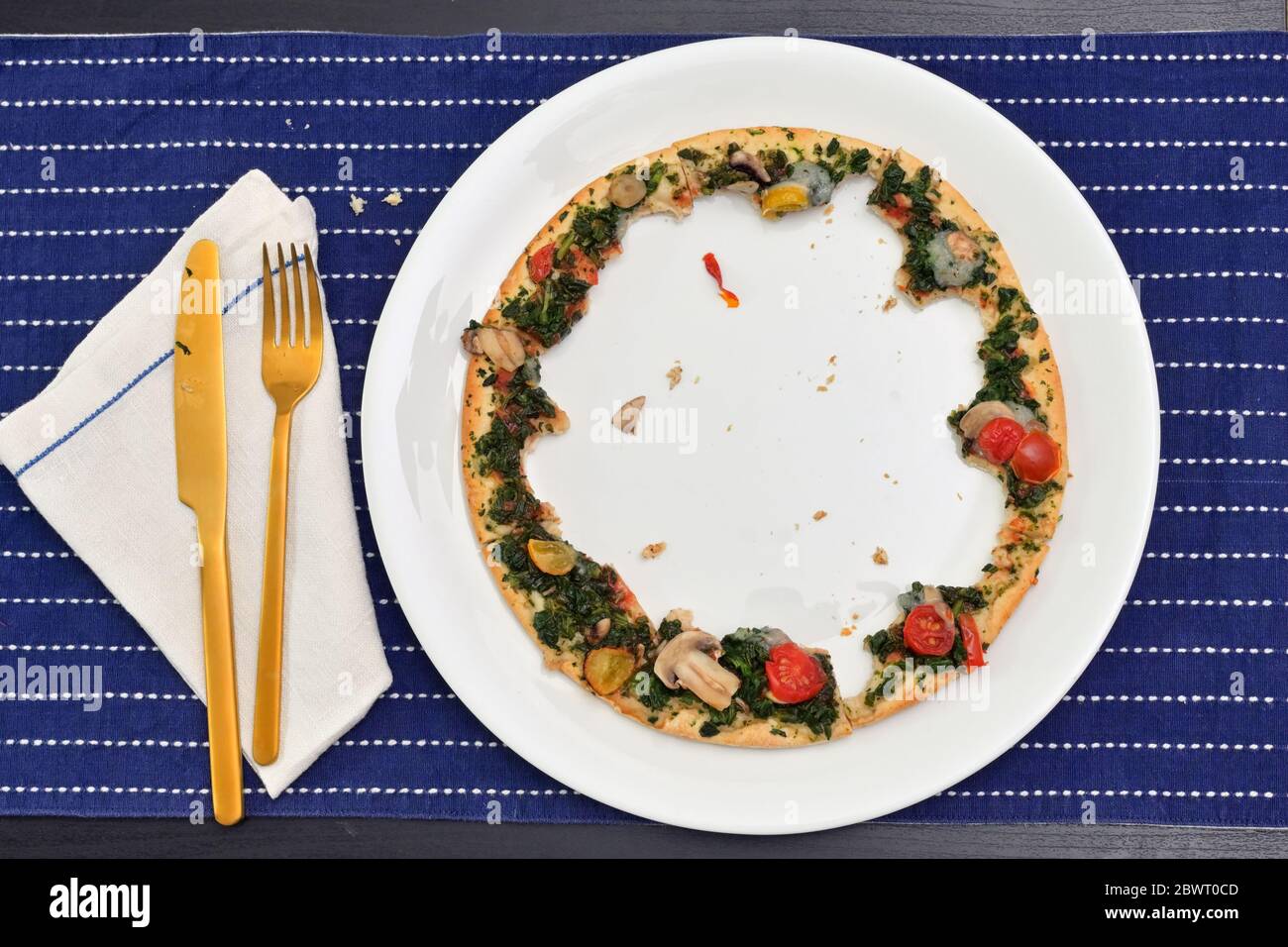 Ready For Revenge Empty Pizza Scrap Remains Stock Photo - Alamy