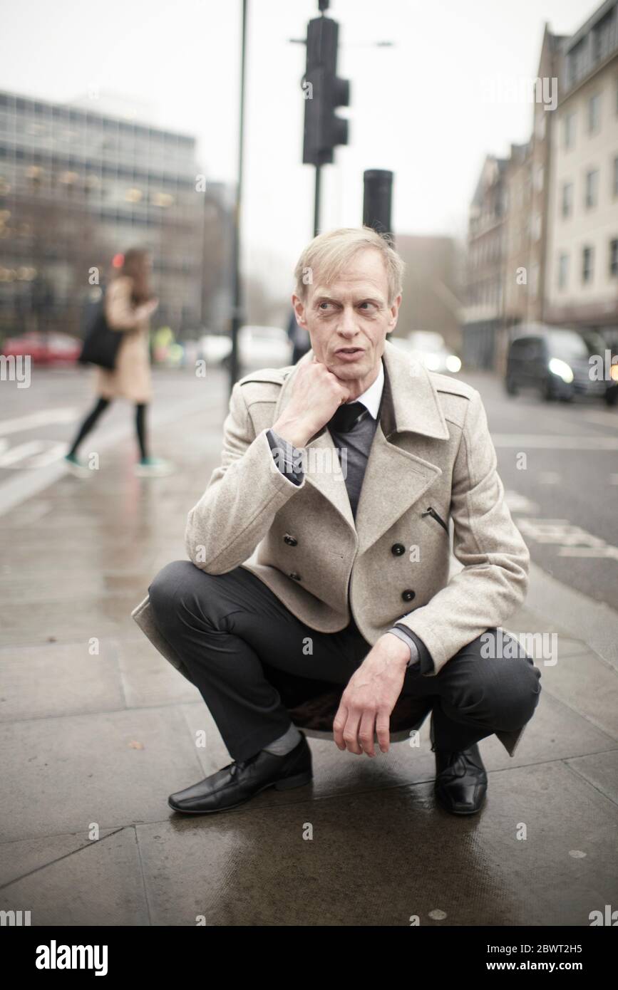 man feeling hunch of volatile emotions at street in London, UK Stock ...