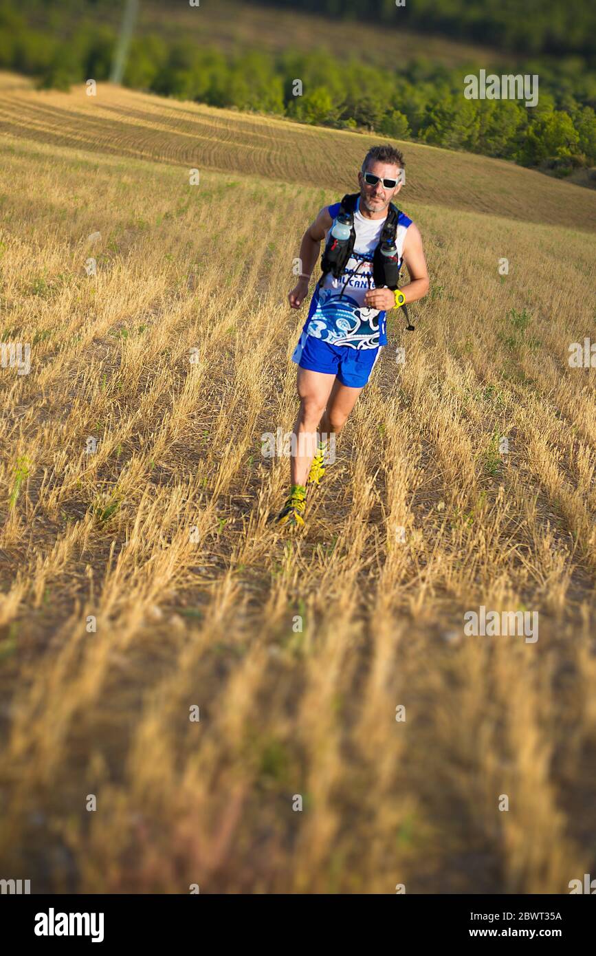 Male runner fields hi-res stock photography and images - Alamy