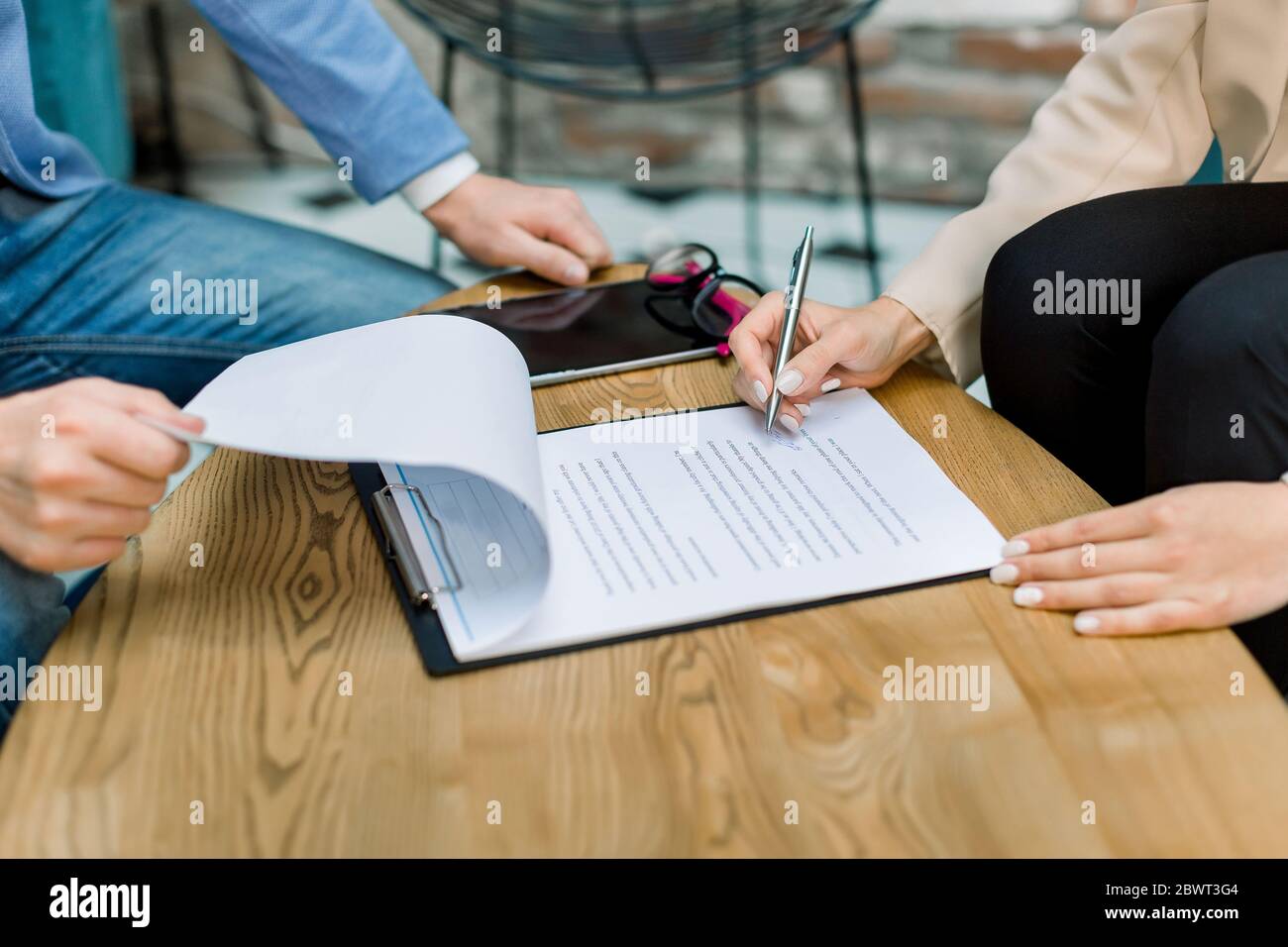 Close up cropped image of hands of two business people, man and woman ...
