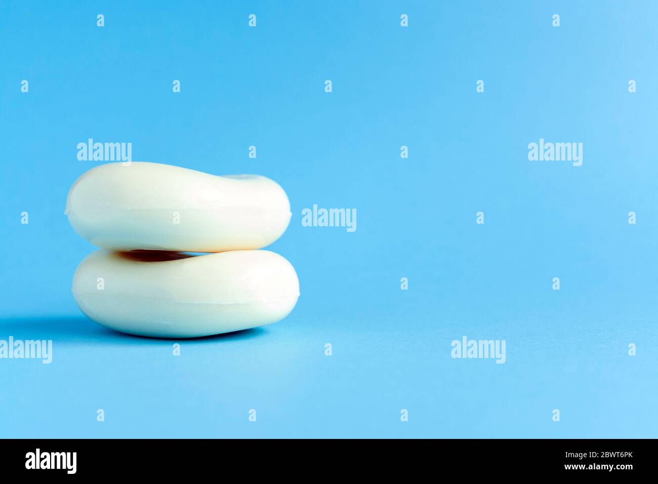 Soap side view on a blue background Stock Photo - Alamy
