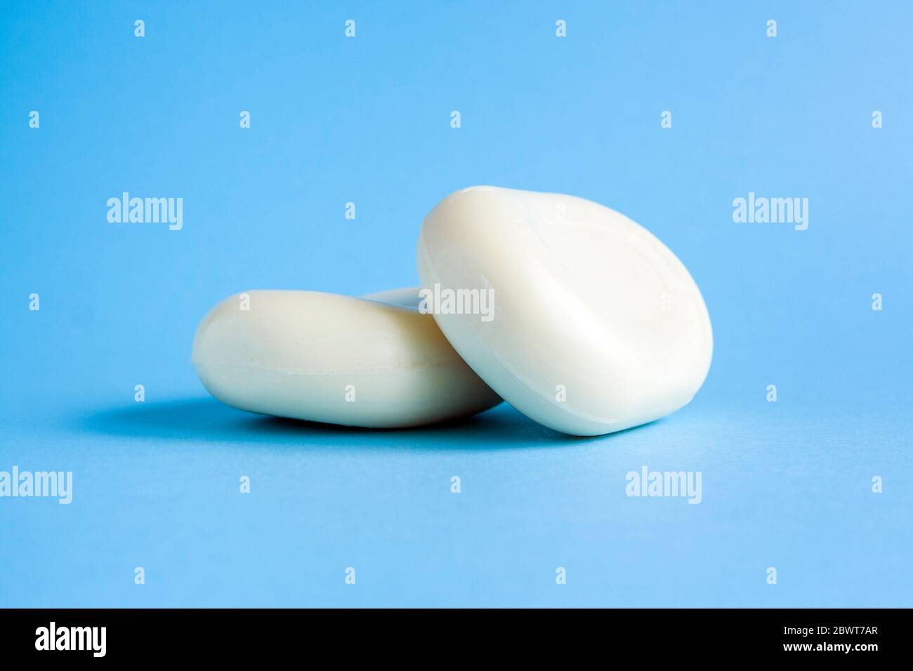 Soap side view on a blue background Stock Photo - Alamy