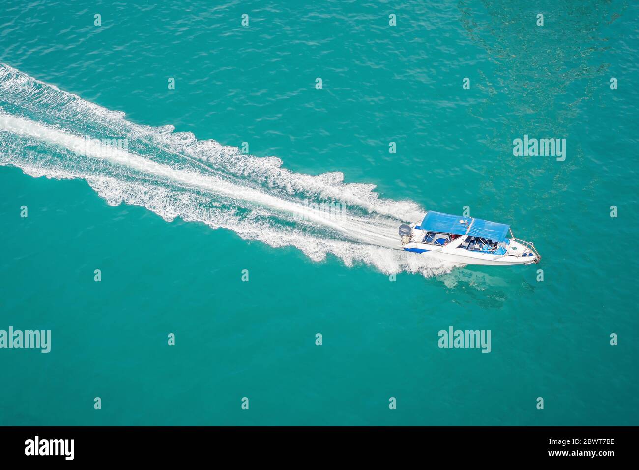 Aerial view of small boat flowing in sea, travel and vacation concept ...