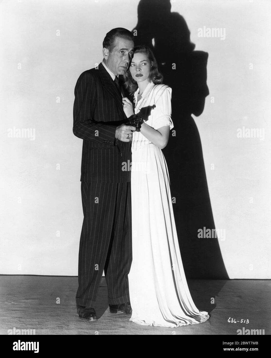 HUMPHREY BOGART as Phillip Marlowe and LAUREN BACALL as Vivian Rutledge ...