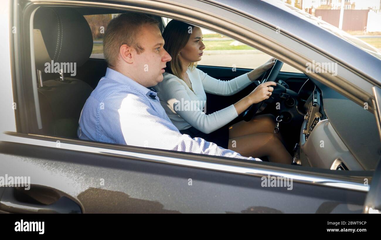 Portrait smiling learner driver instructor car hi-res stock photography ...